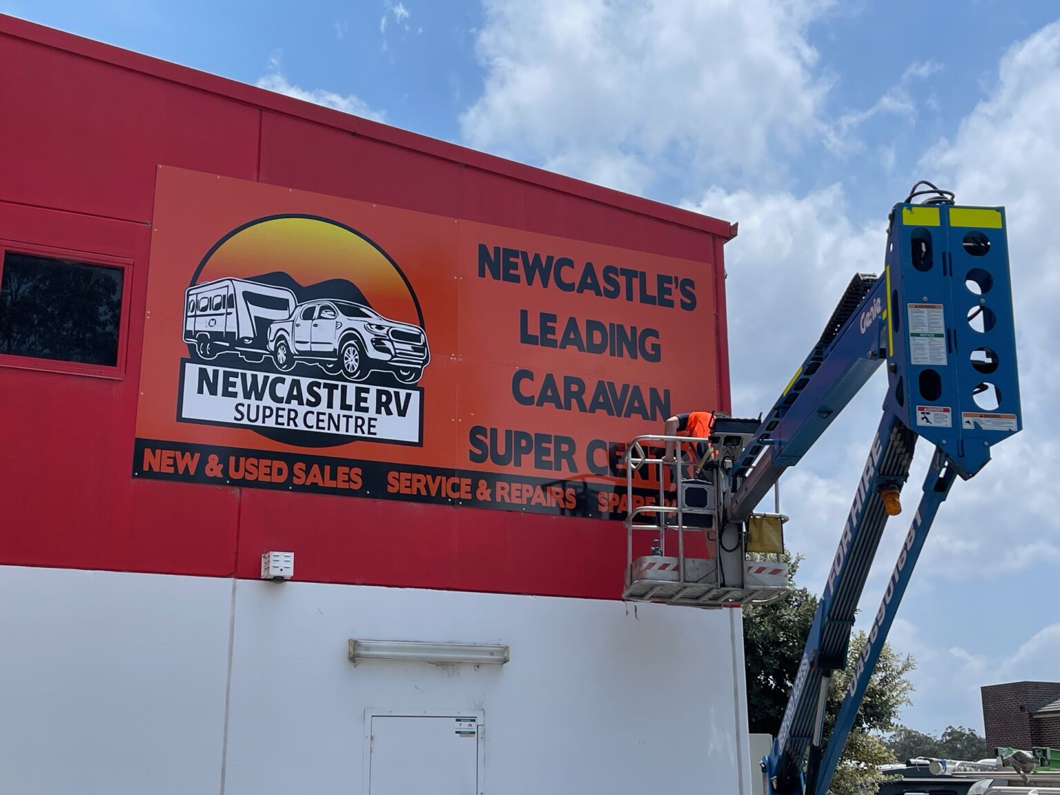 New building sign installed for a retail shop in Newcastle